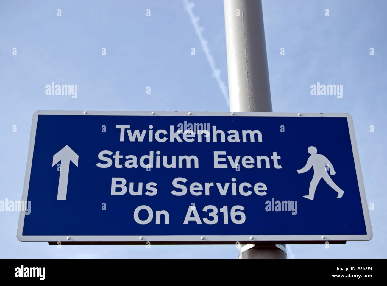 blue and white sign with arrow and walking man image indicating special ...