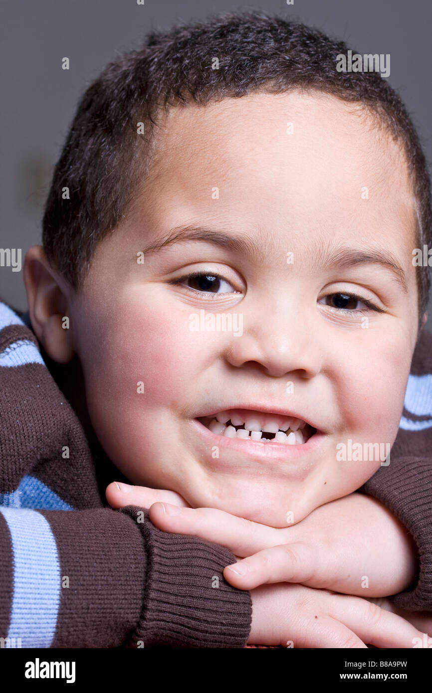 Young boy with missing baby tooth smiling Stock Photo - Alamy