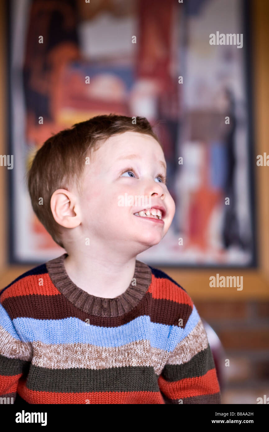 Cute happy boy wearing colorful sweater Stock Photo - Alamy