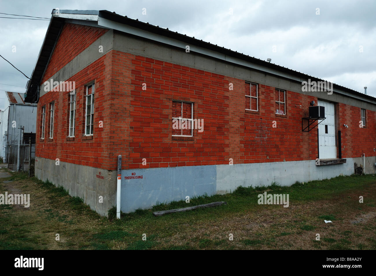 A worn red brick building Stock Photo - Alamy