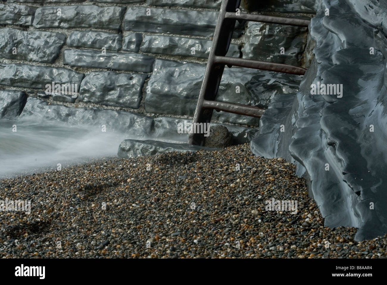 Aberystwyth Beach retaining wall with footprints Stock Photo - Alamy