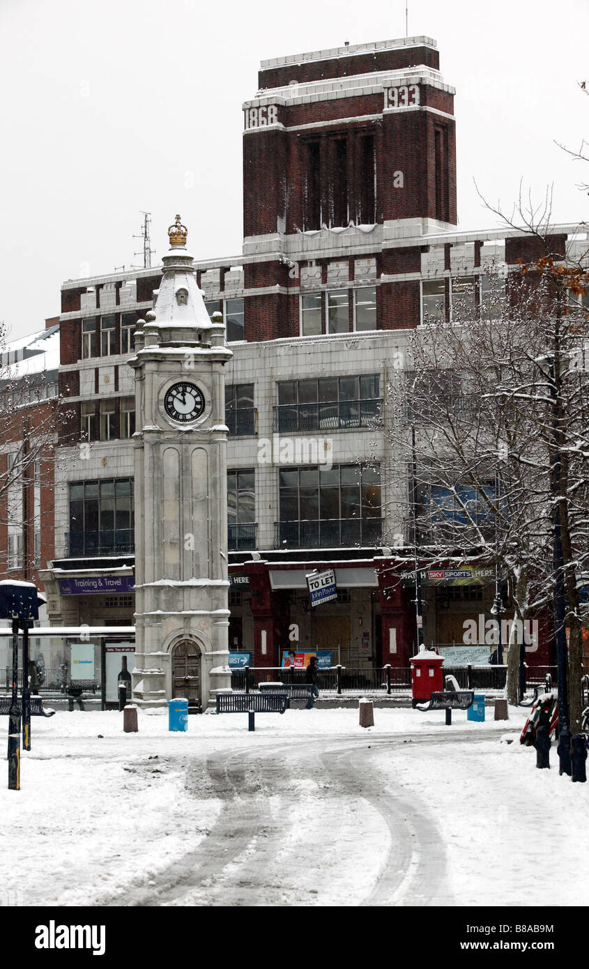 Winter shot of Lewisham Clock Tower with the former Army and Navy ...