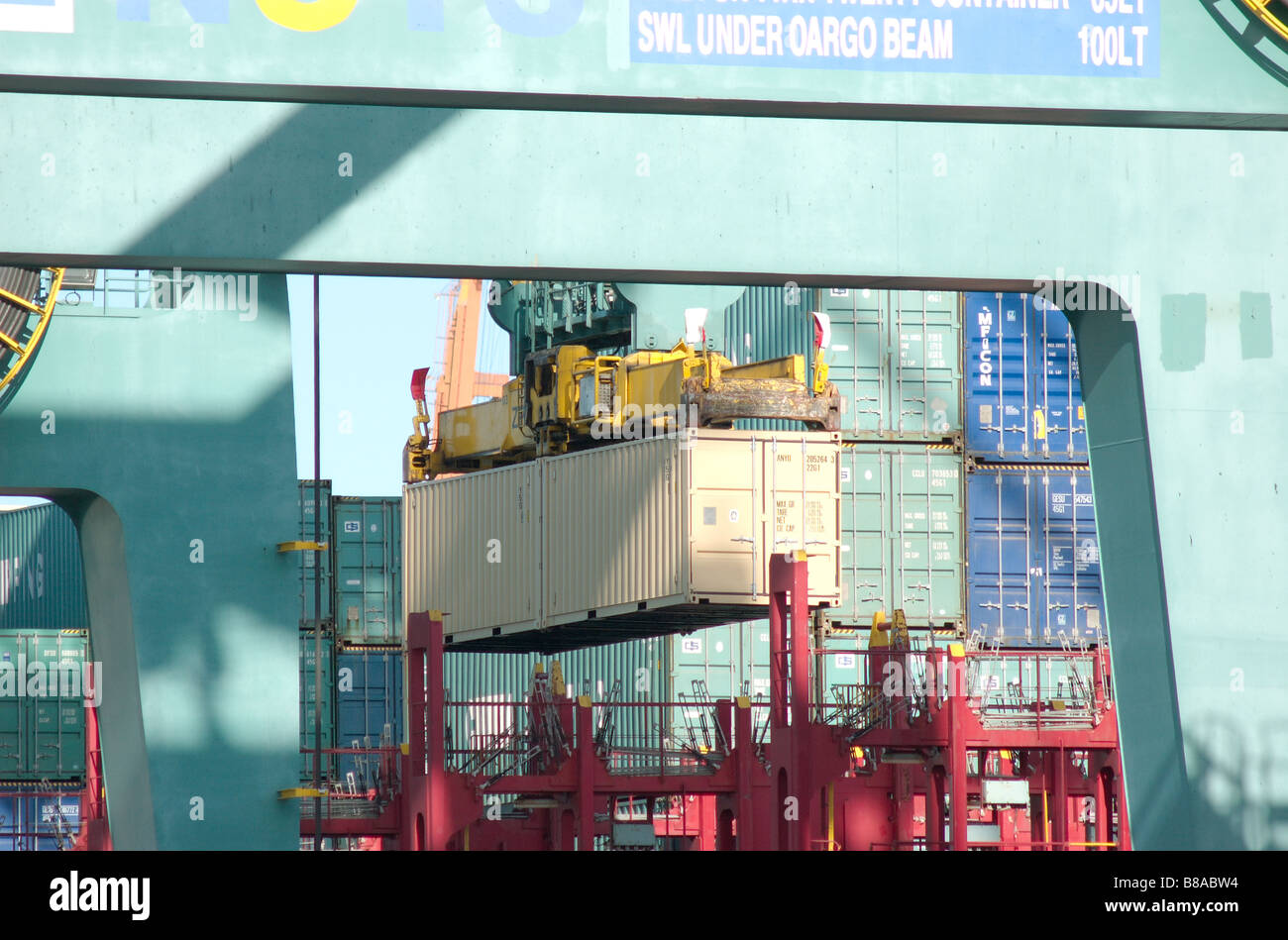 A cargo container being moved off of a ship in Los Angeles Harbor Stock ...
