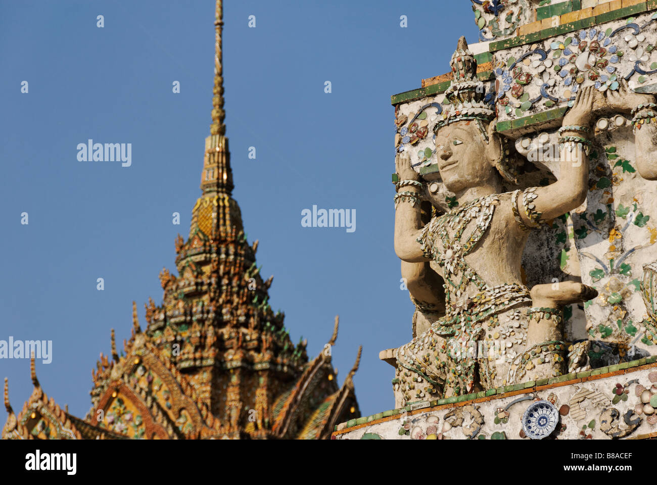 Detail of ceramic tiles and statue - Wat Arun buddhist temple in ...