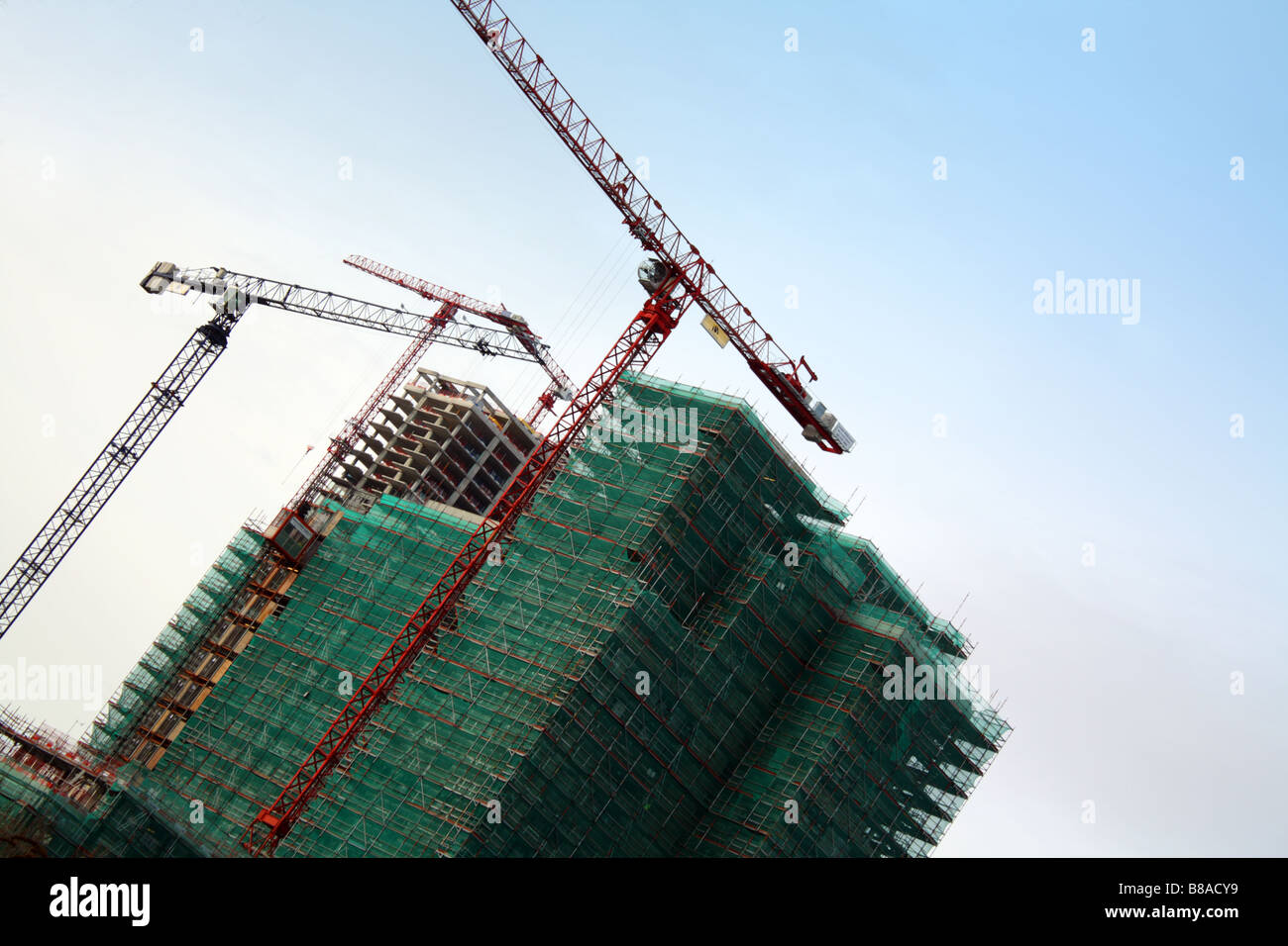 Generic construction picture of scaffolding and cranes Stock Photo - Alamy
