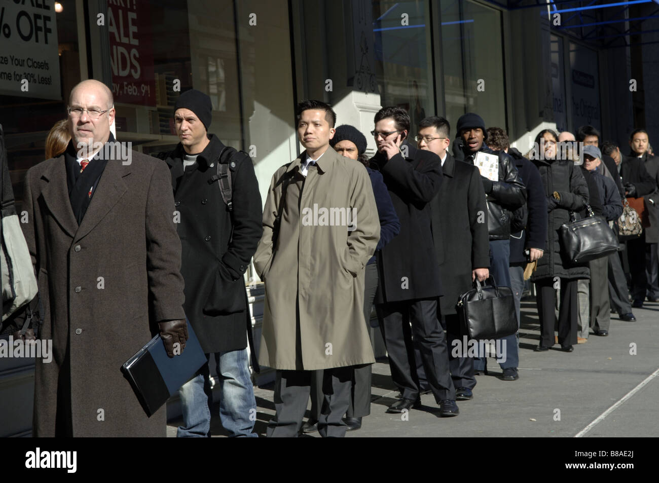 Hundreds of people line up in New York for a job fair sponsored by the ...