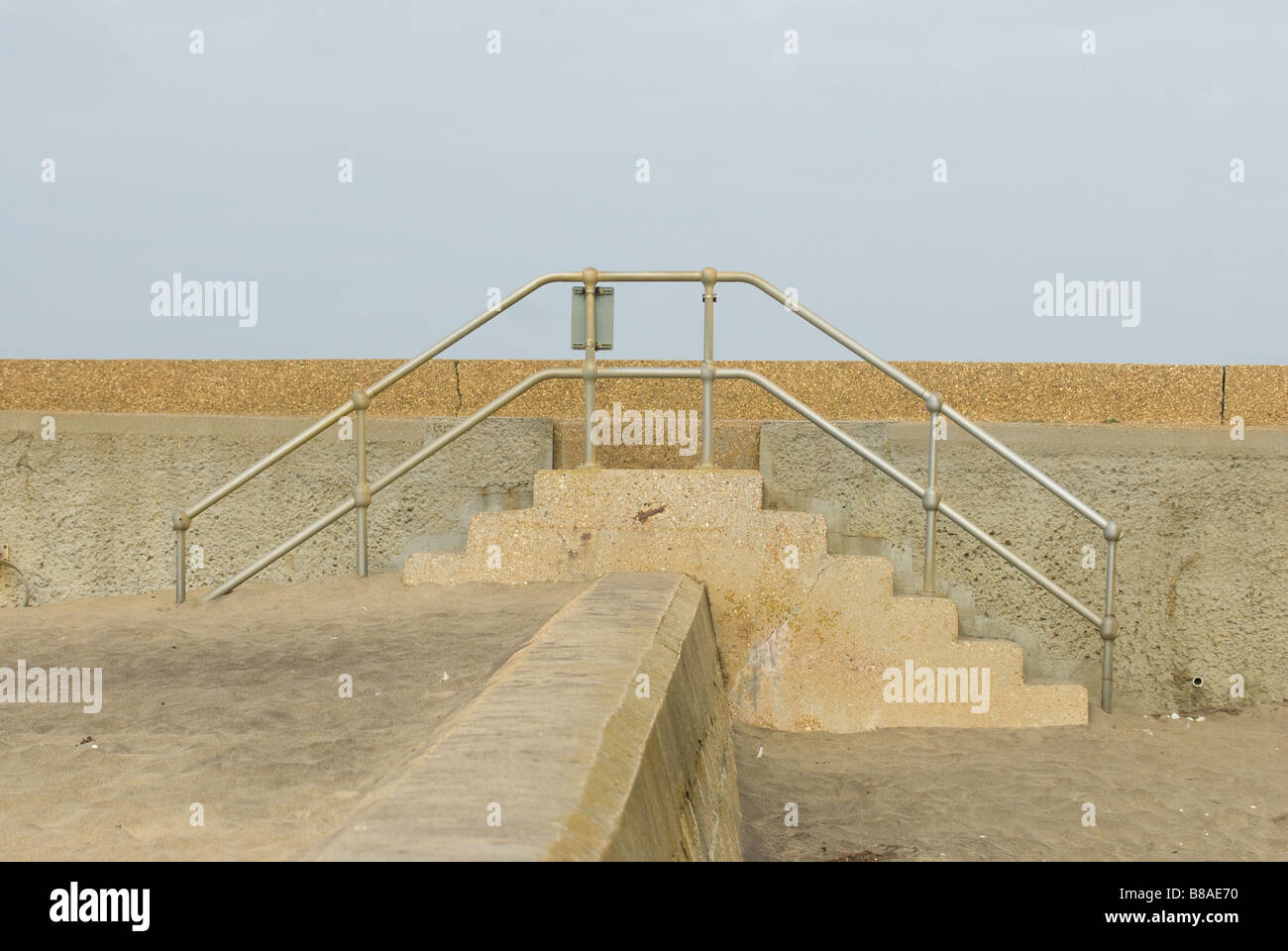 concrete steps with handrail along seafront wall Stock Photo - Alamy