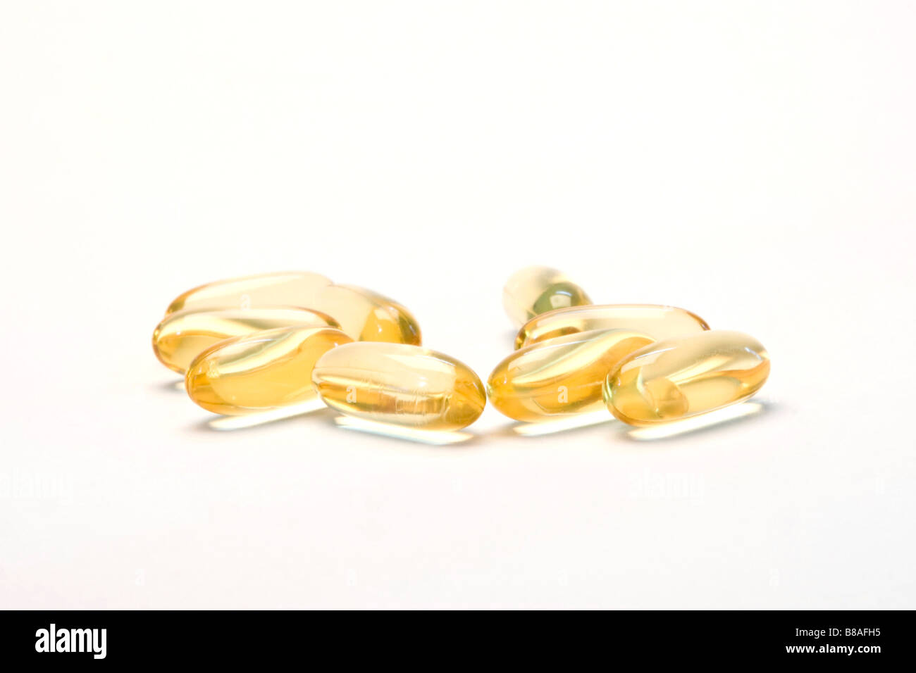 Fish oil capsules are seen in a cutout photo Stock Photo - Alamy