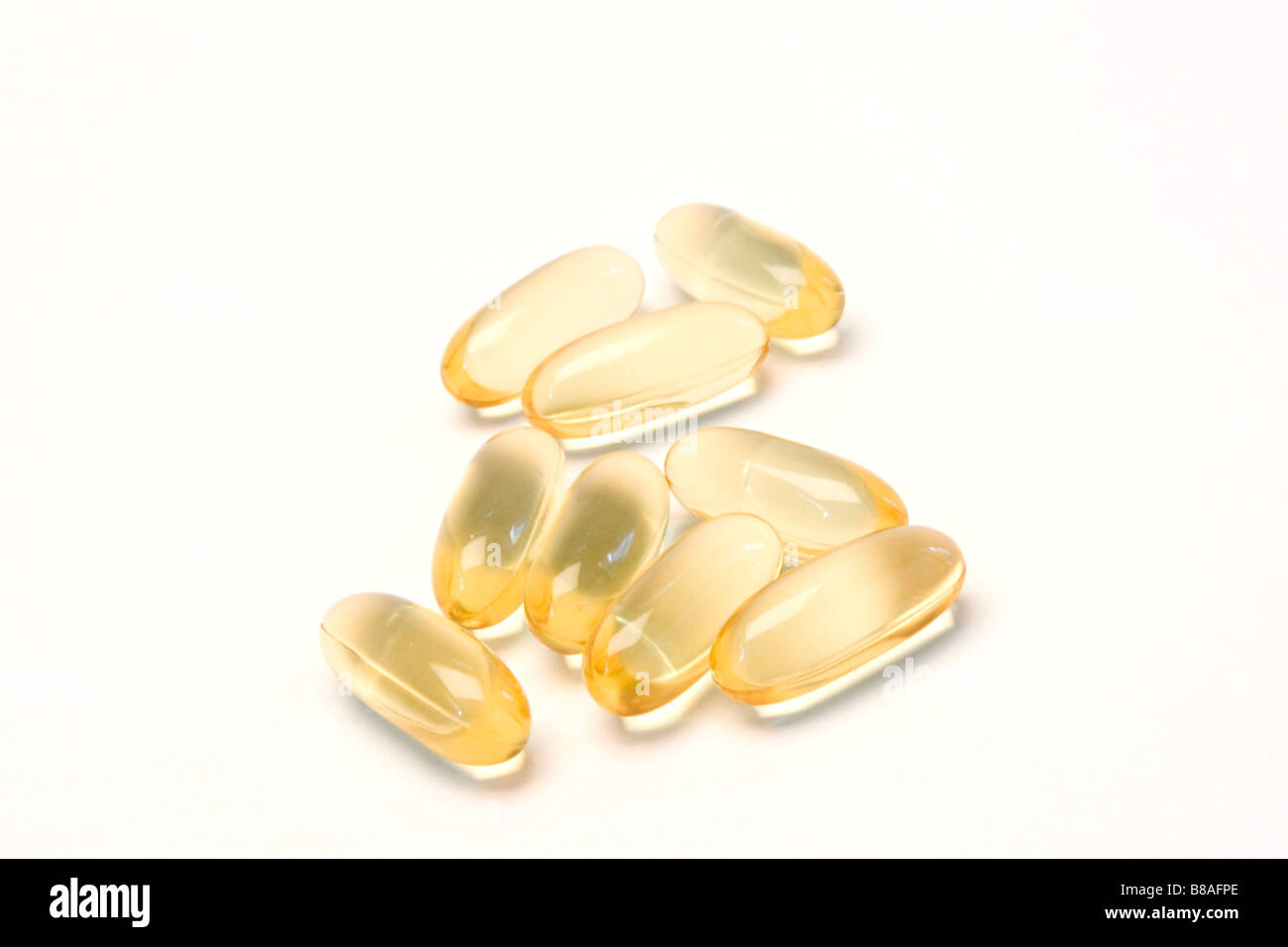 Fish oil capsules are seen in a cutout photo Stock Photo - Alamy