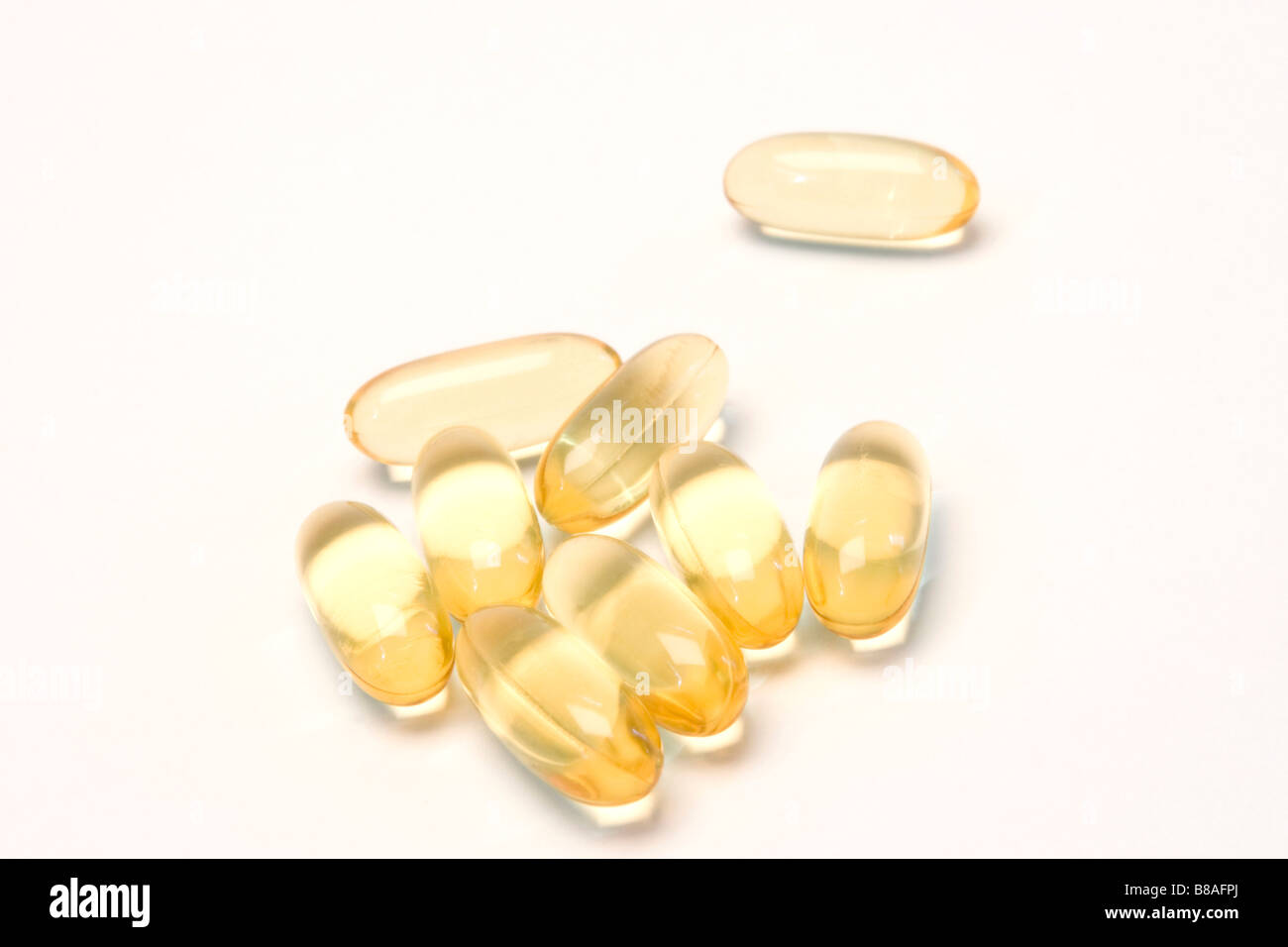 Fish oil capsules are seen in a cutout photo Stock Photo - Alamy