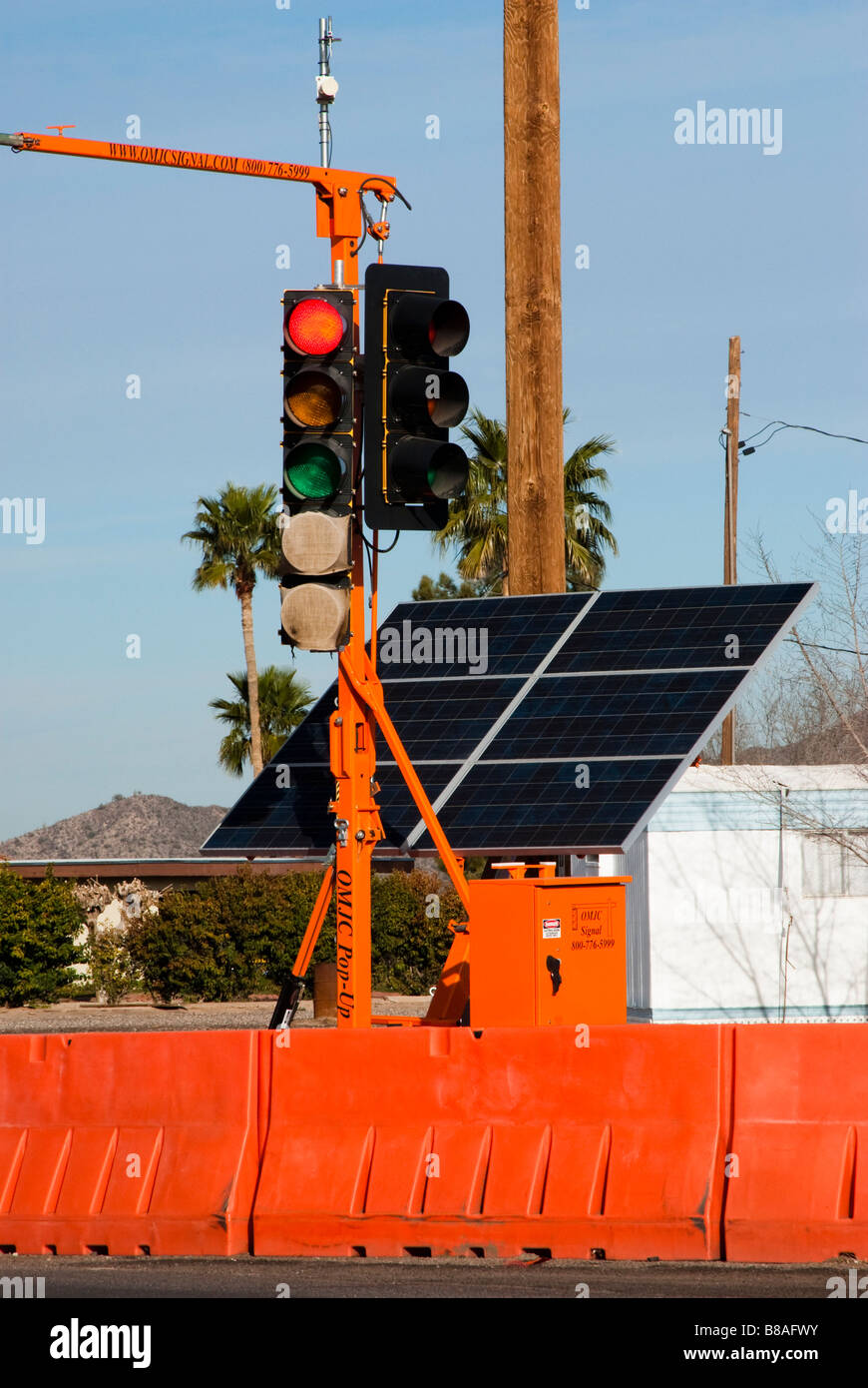 temporary solar powered traffic control lights at a street intersection ...