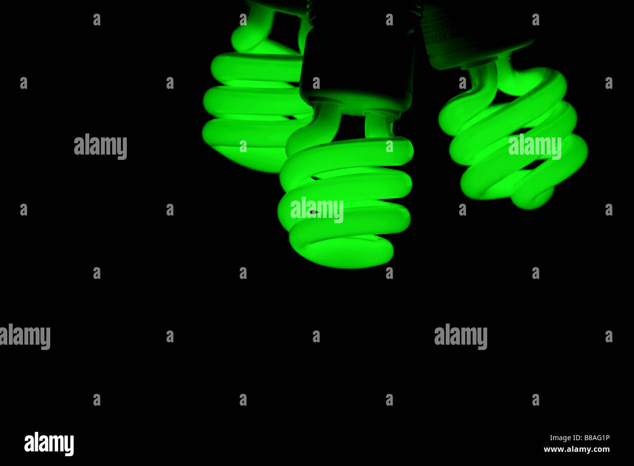 A green fluorescent energy saving light bulb Stock Photo - Alamy