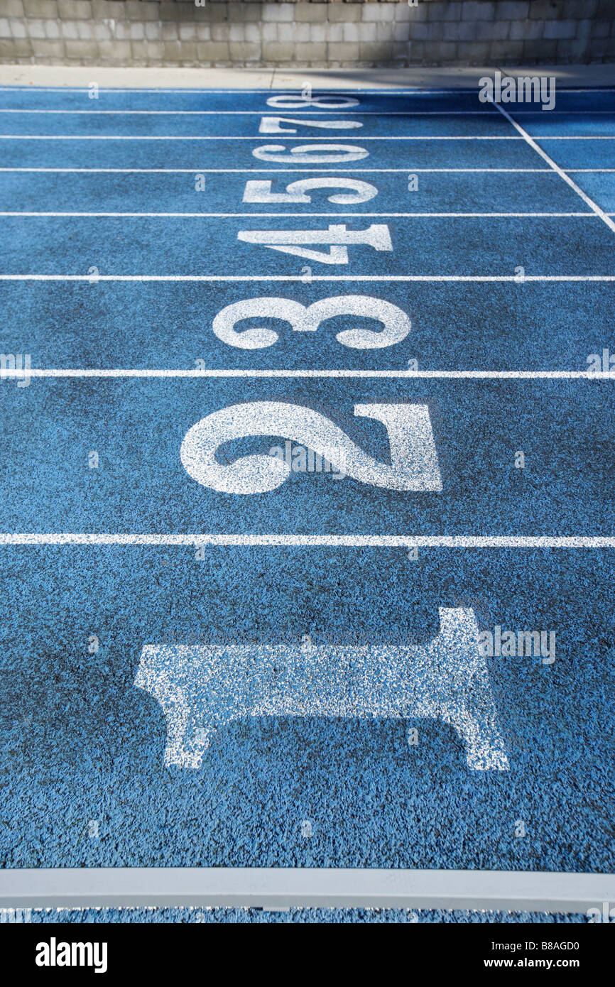 A blue track at a High School Stock Photo - Alamy