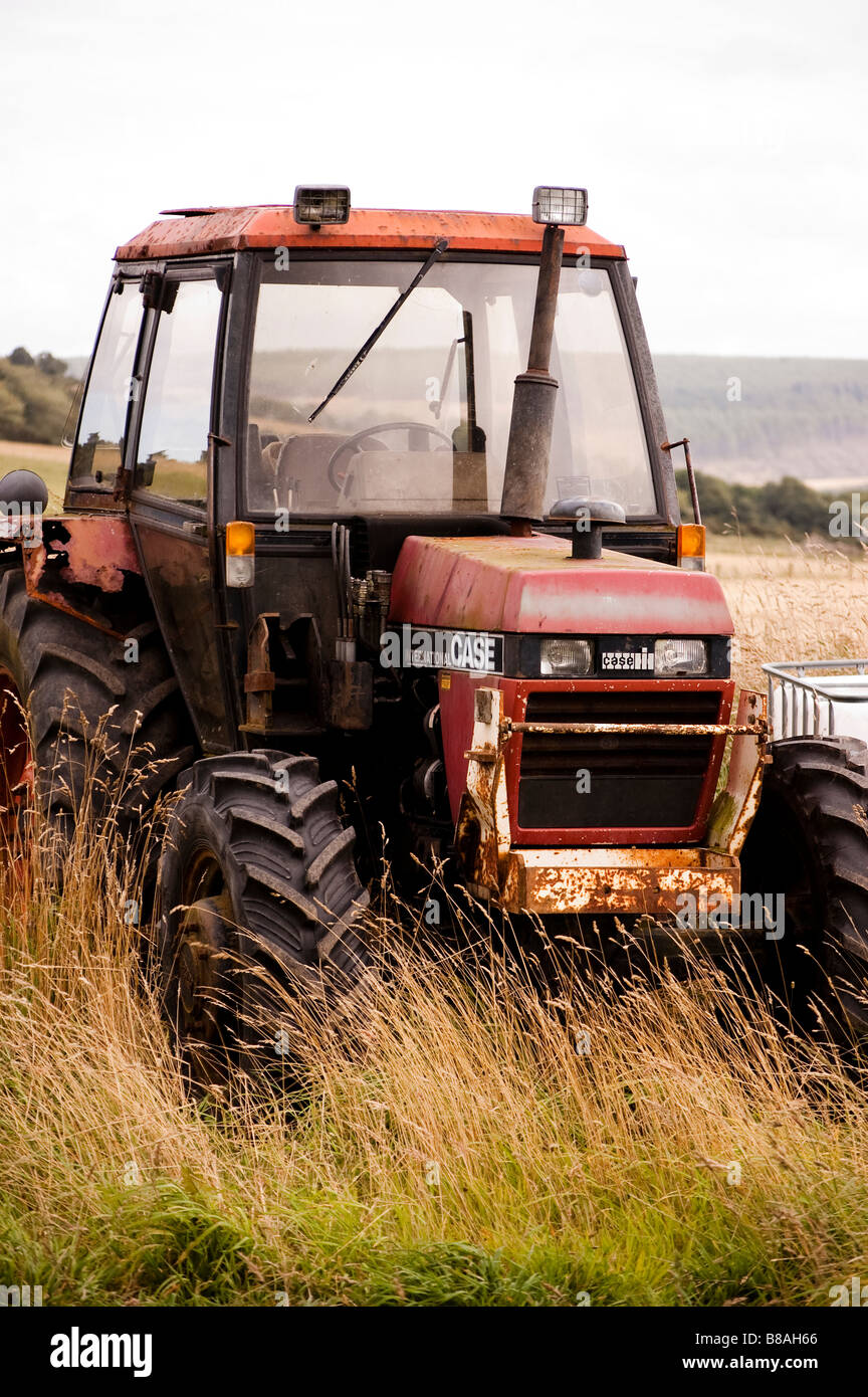 Red rusty modern tractor Stock Photo - Alamy