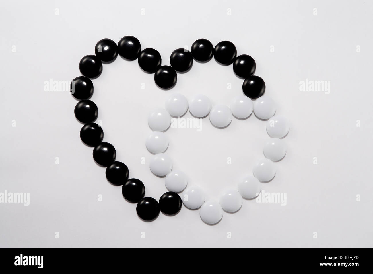 Go pieces form two hearts Stock Photo - Alamy