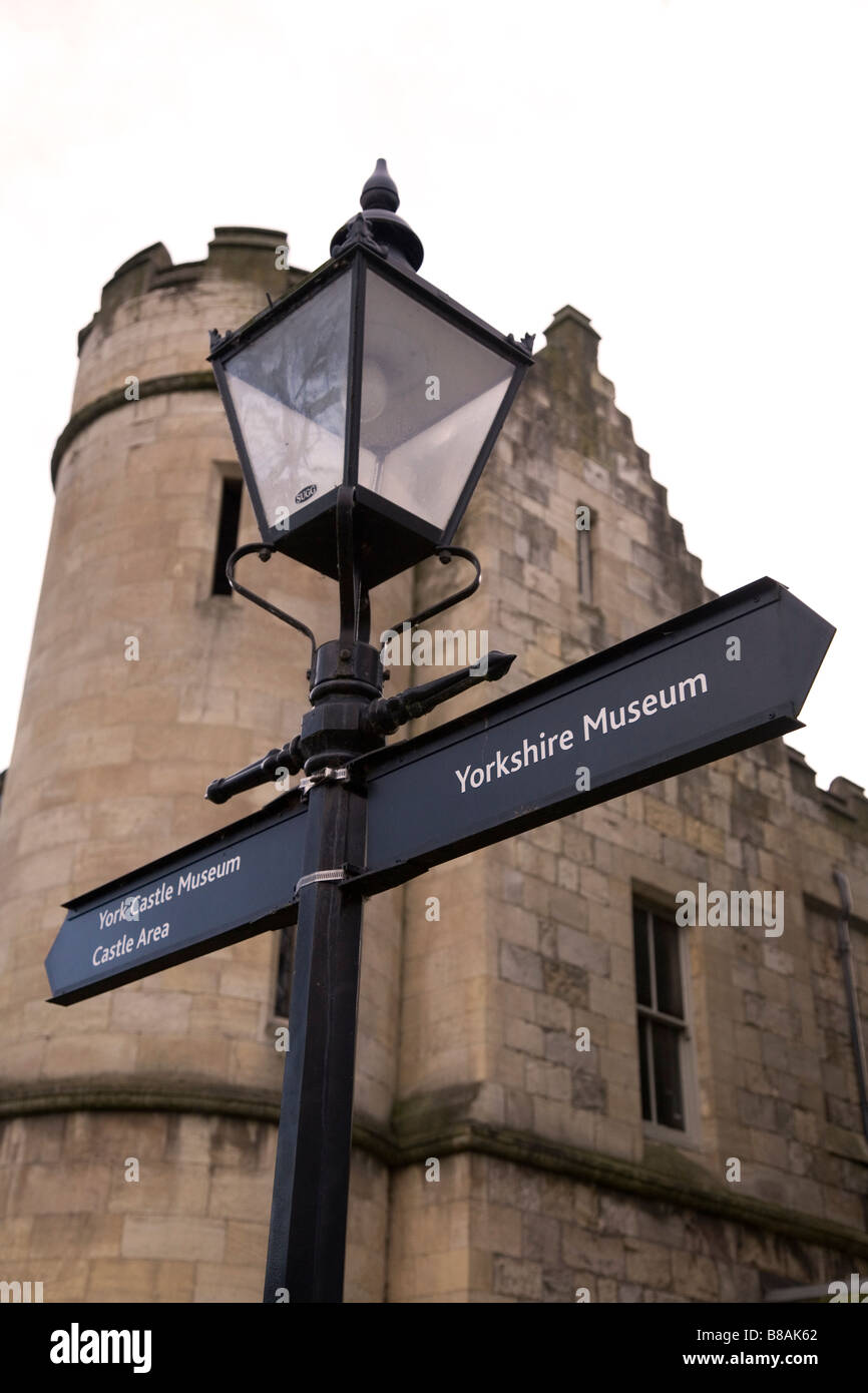 A street sign gives directions to tourist attractions in the historic ...