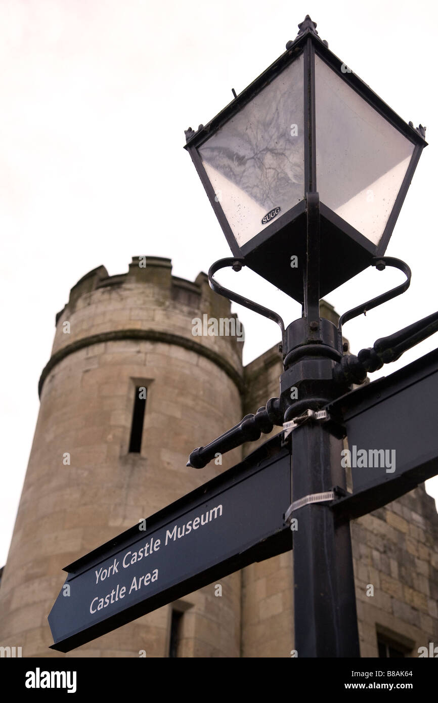 A street sign gives directions to tourist attractions in the historic ...