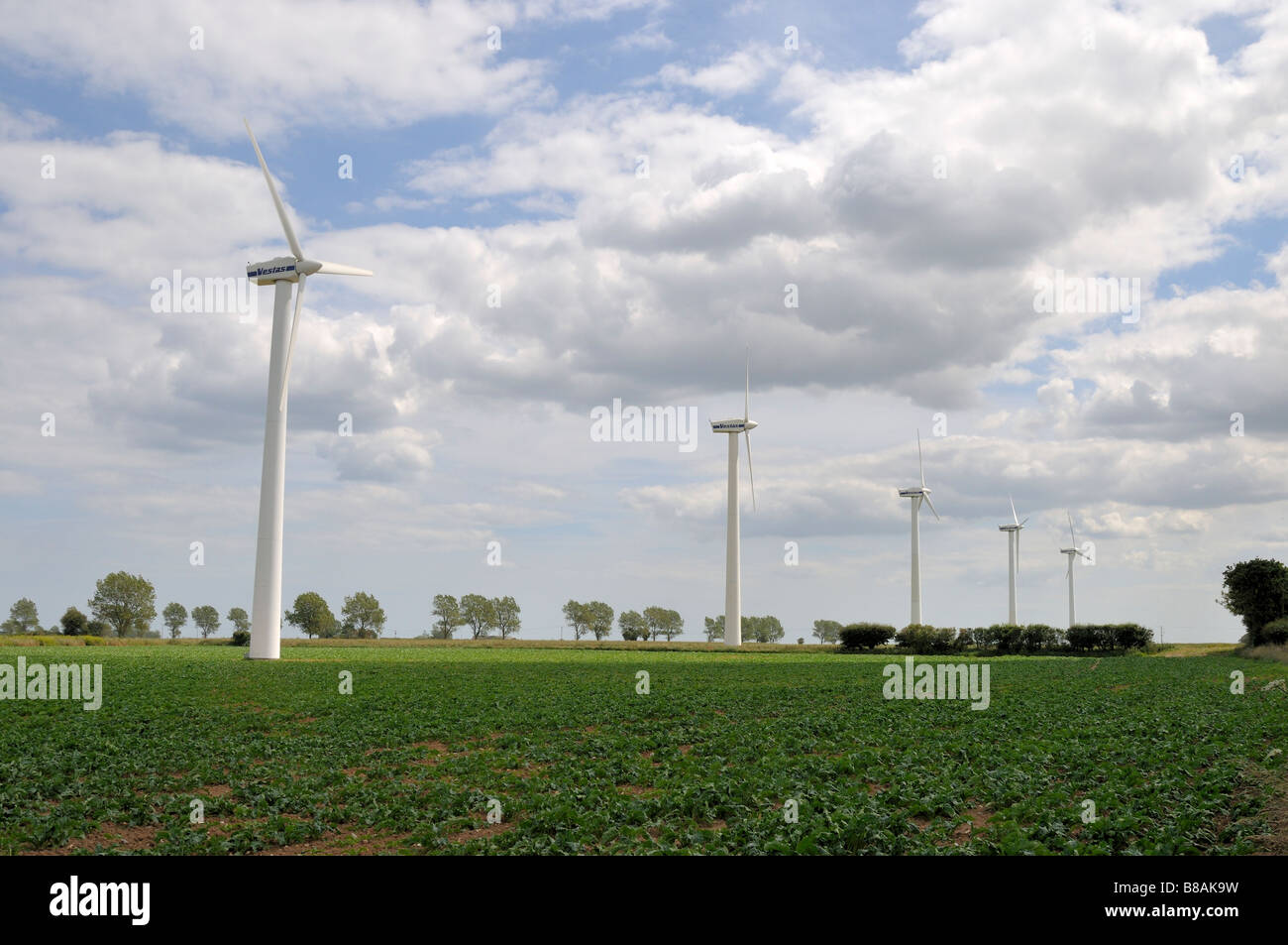 Energy producing wind turbines on a farm in Norfolk England Stock Photo ...