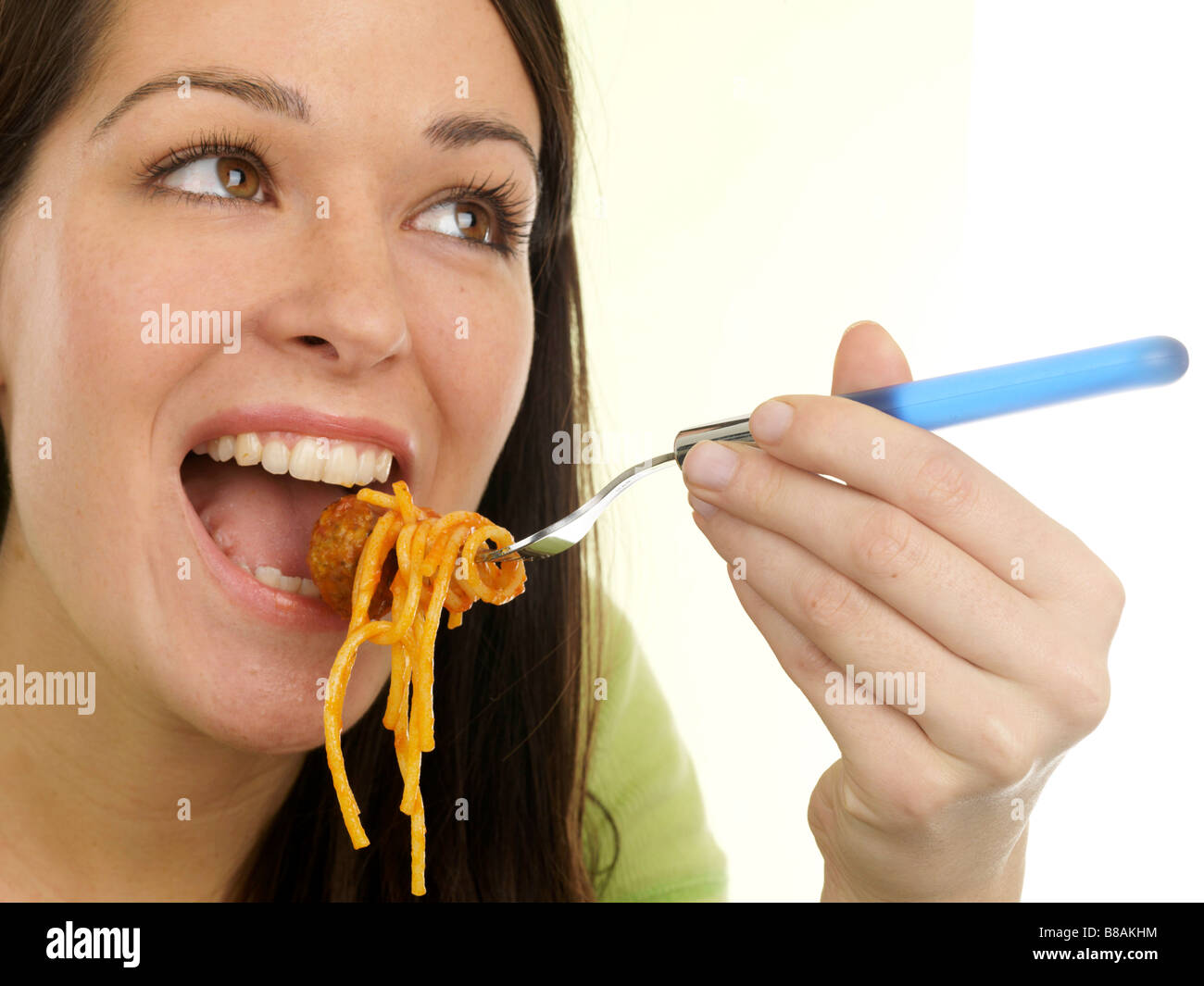 Happy Positive Young Woman Eating Italian Style Spaghetti and Meatballs ...