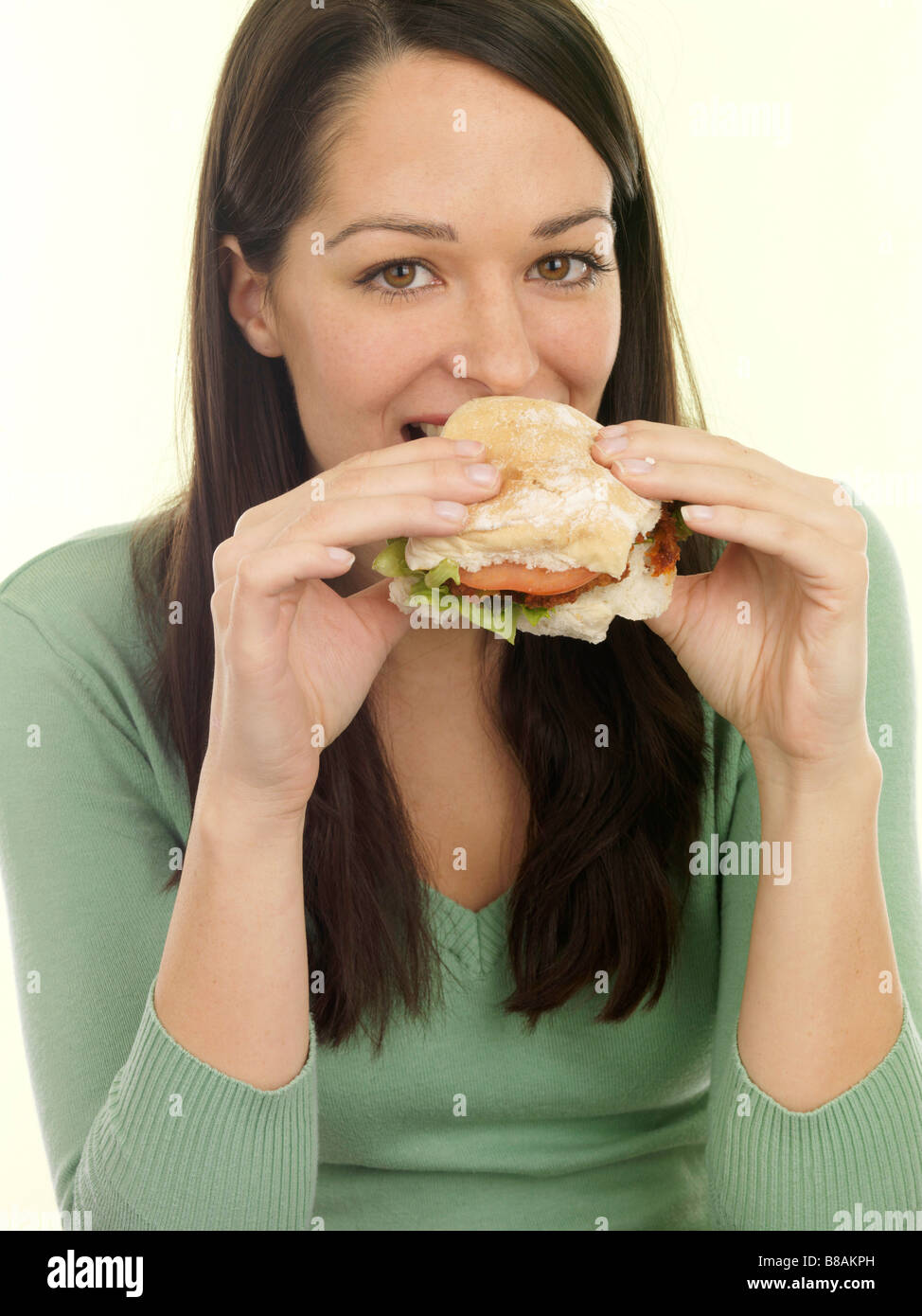 Young Woman Eating Bean Burger Model Released Stock Photo - Alamy