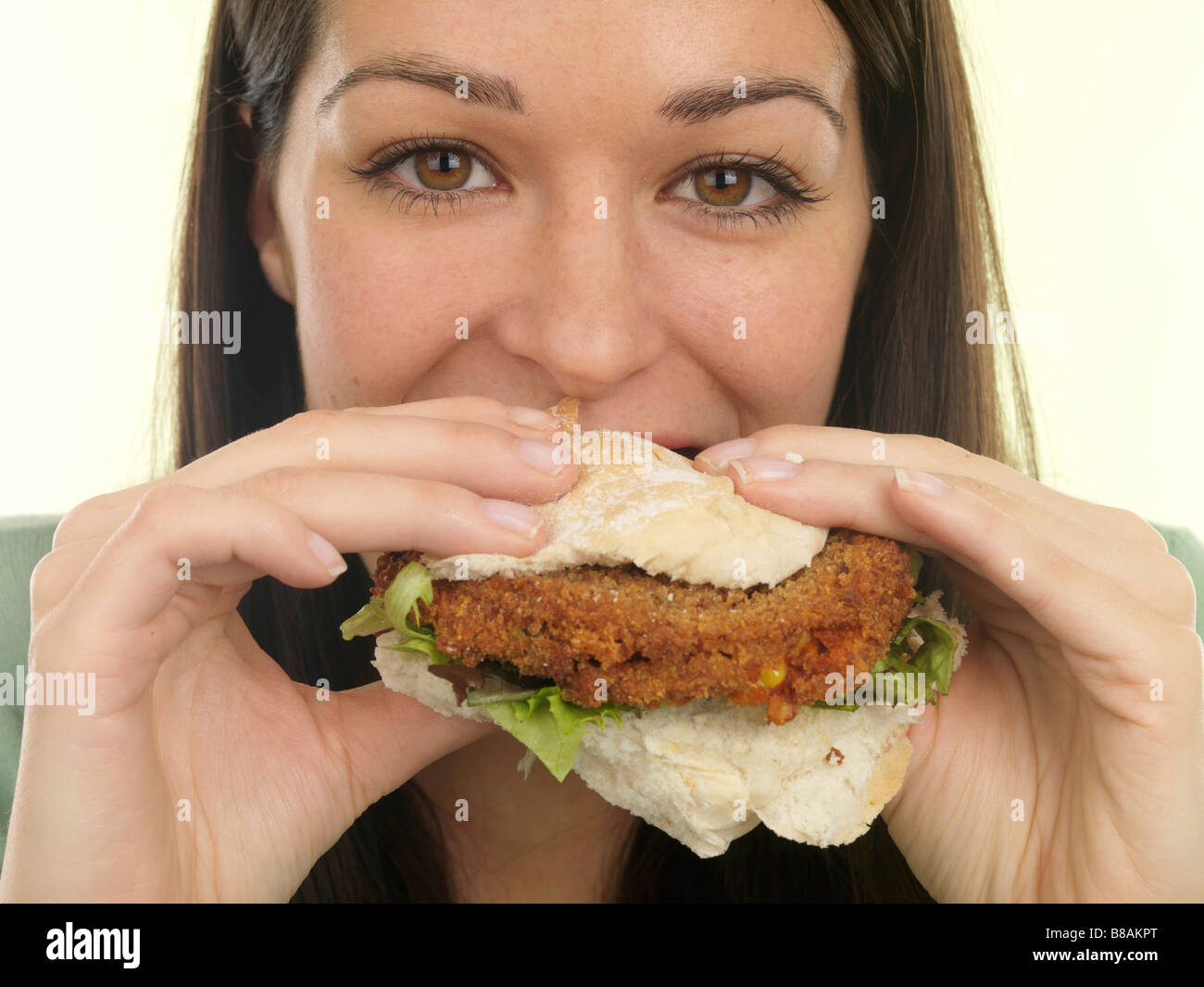 Young Woman Eating Bean Burger Model Released Stock Photo - Alamy