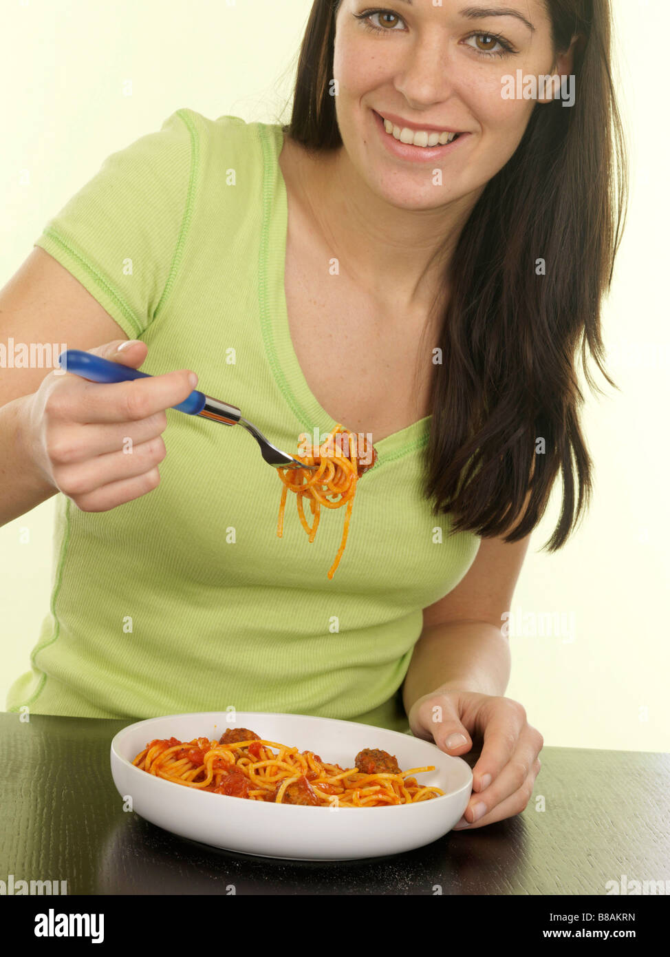 Young Woman Eating Spaghetti and Meatballs Model Released Stock Photo ...