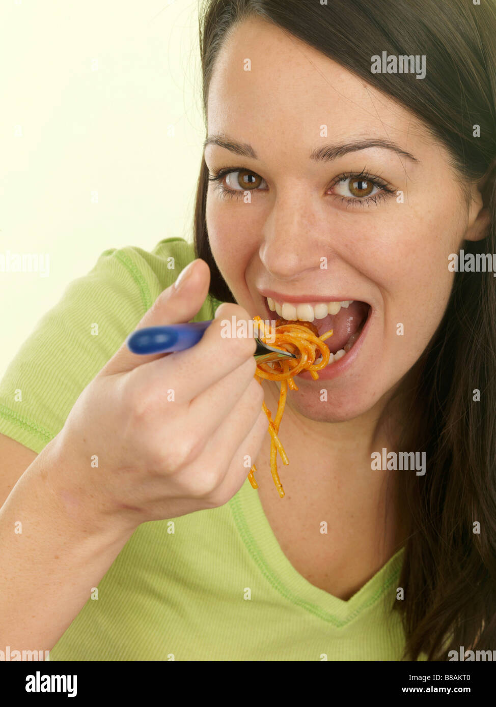 Young Woman Eating Spaghetti and Meatballs Model Released Stock Photo ...