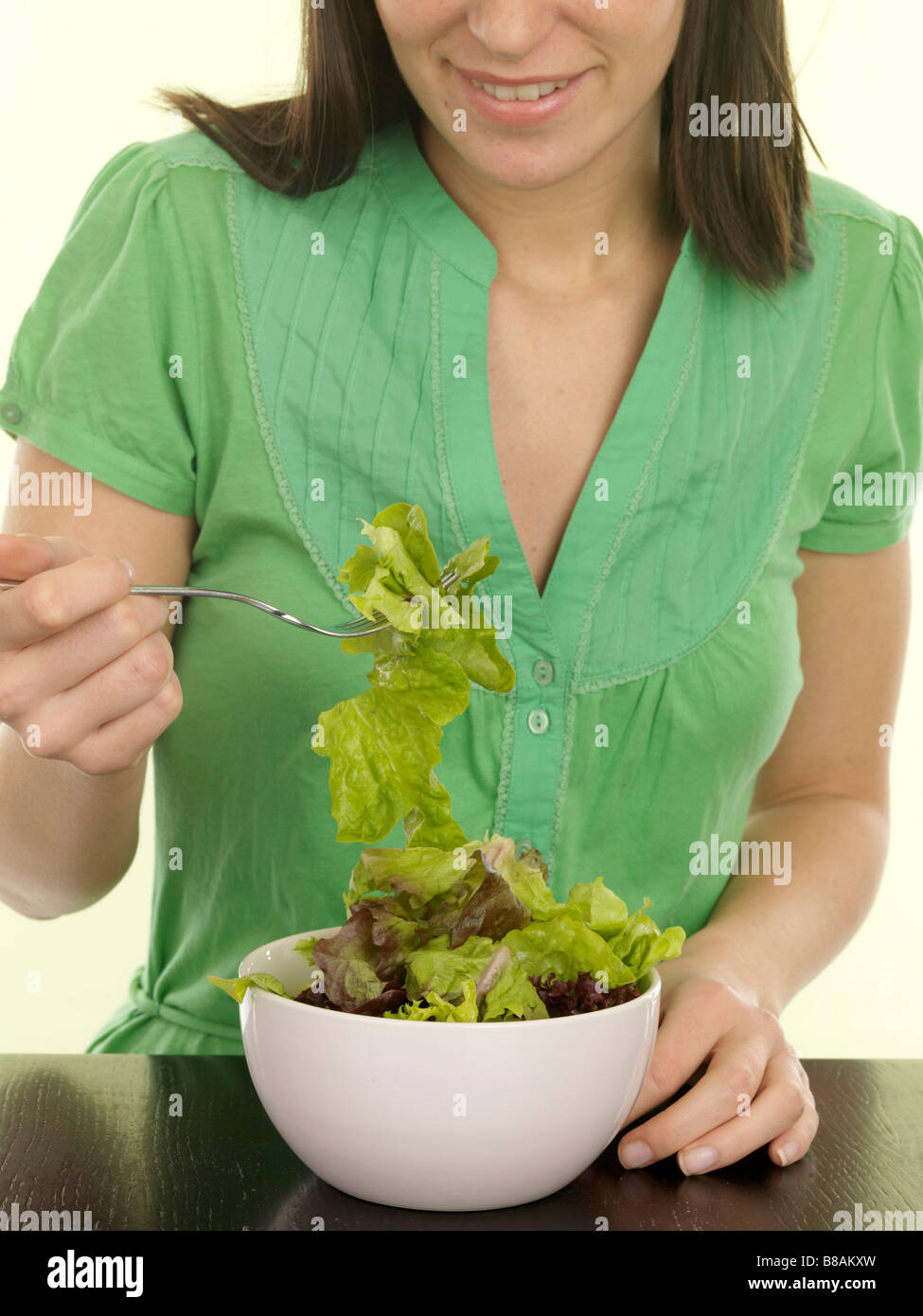 Young Woman Eating Green Salad Model Released Stock Photo - Alamy