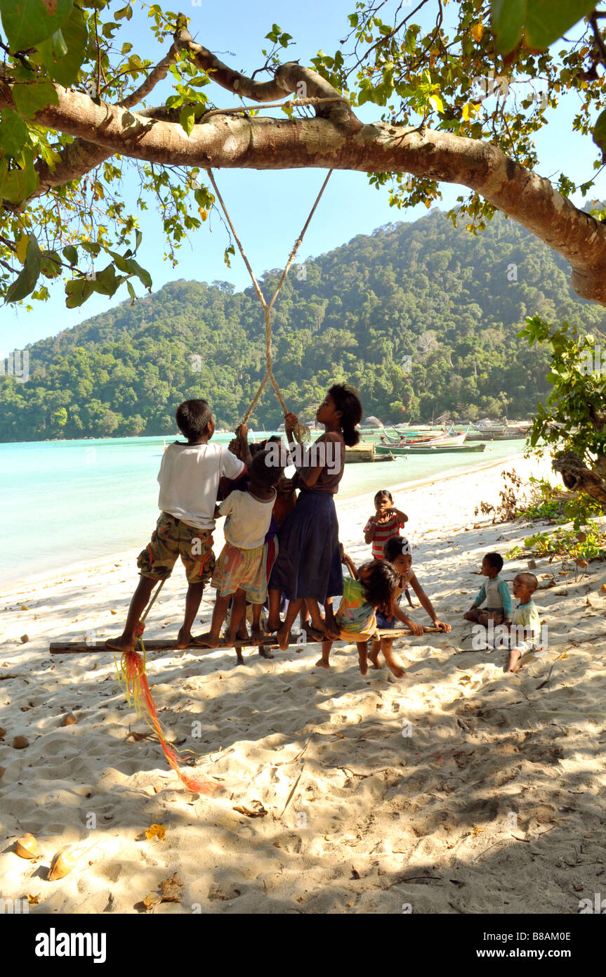 Moken sea gypsy kids enjoy playing swing,Koh Surin,Southern Thailand ...