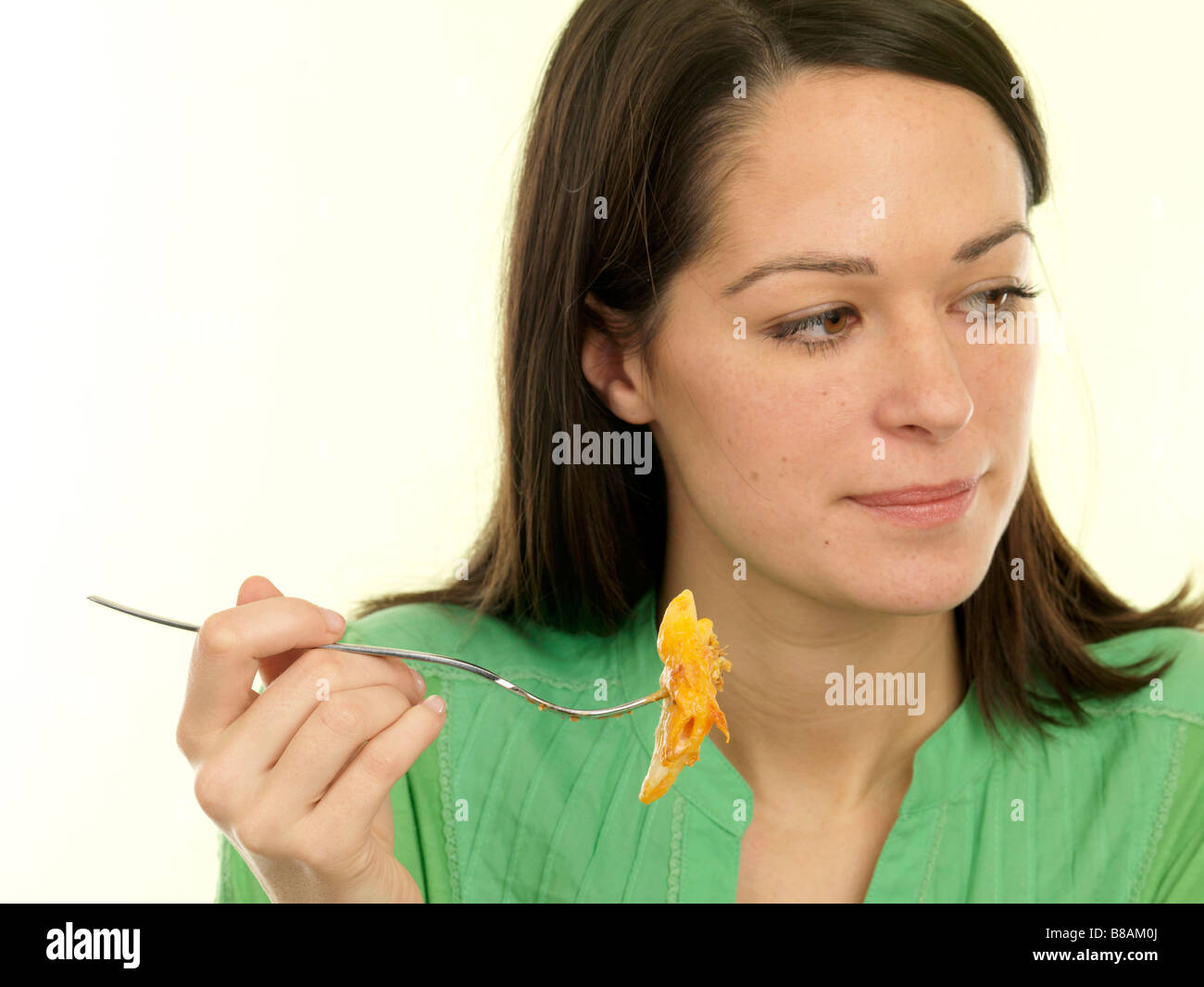 Young Woman Eating Pasta Bake Model Released Stock Photo - Alamy