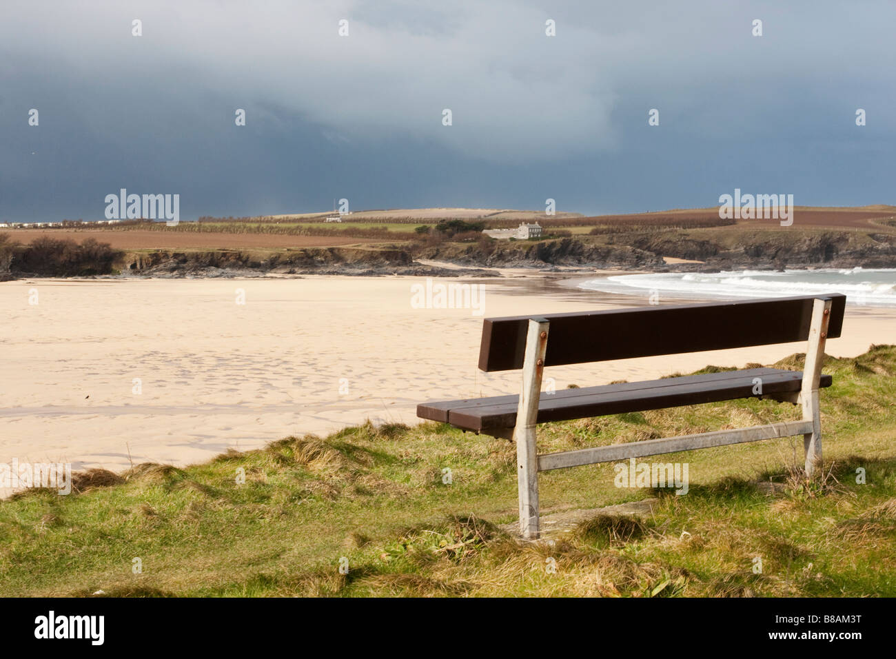 bench seat overlooking a deserted beach Stock Photo - Alamy