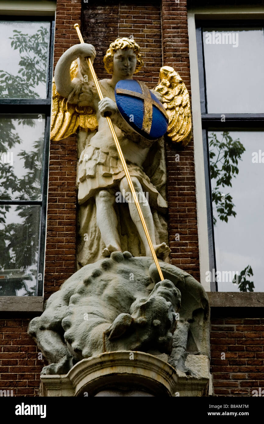 a statue of st. george slaying a dragon adorning a house in amsterdam ...