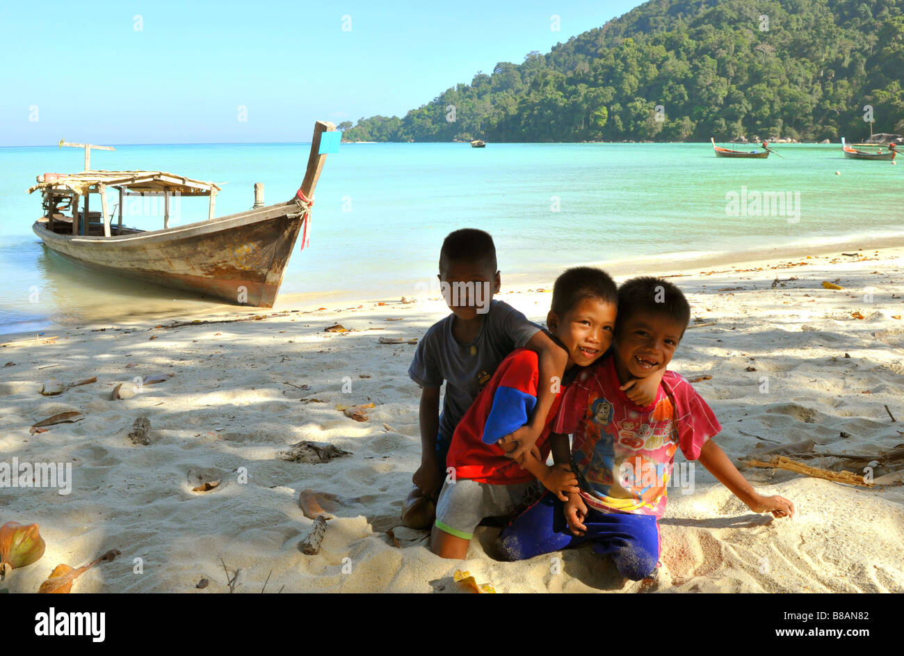 Moken sea gypsy kids enjoy playing with sand by the beach,Koh Surin ...