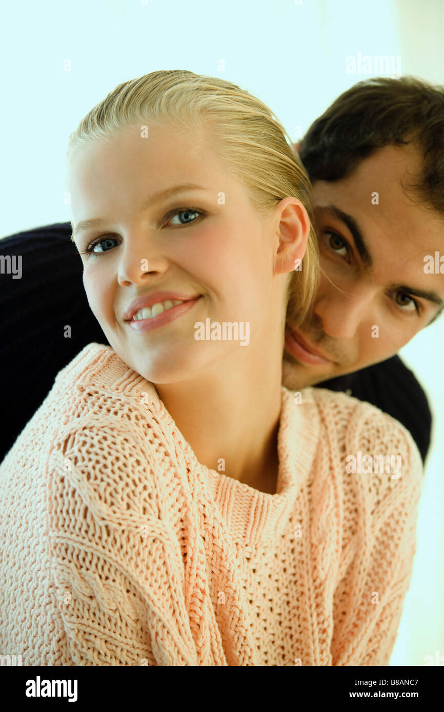 Portrait of Young Couple man is Looking Over The Shoulder of his ...