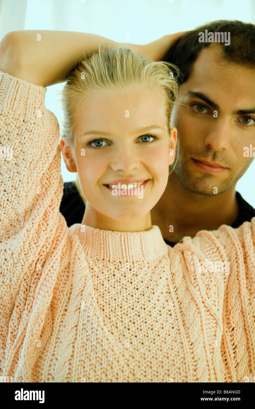 Portrait of Young Couple Man is Looking over Shoulder of his Girlfriend ...