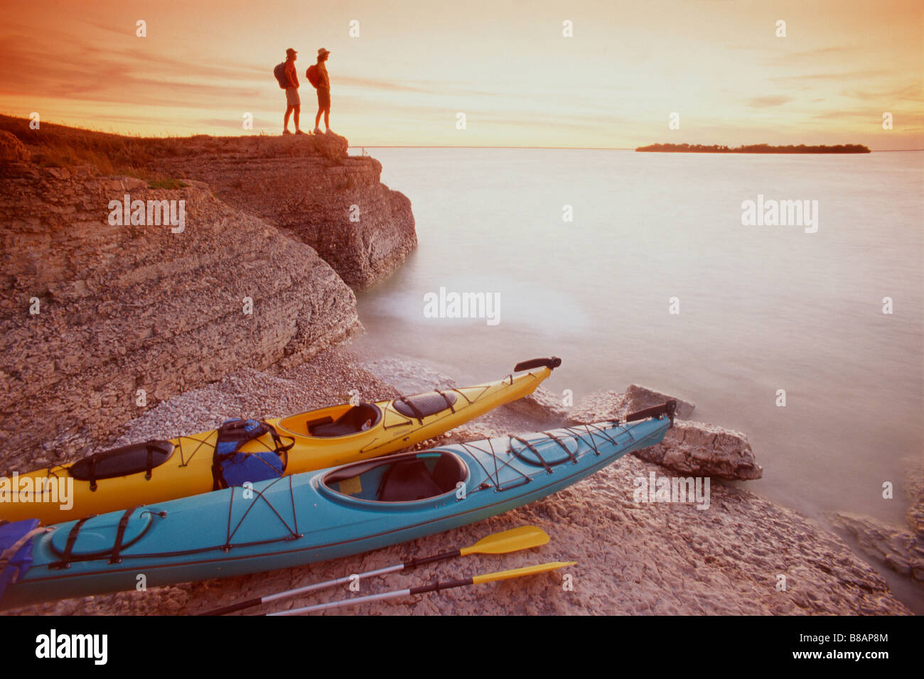 FV3303, Dave Reede; Two Kayaks Shore, Couple Standing Limestone Cliff ...