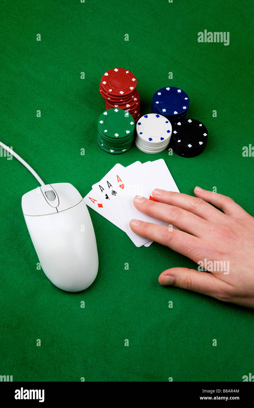 An online gambling concept computer mouse hand and casino chips Stock ...