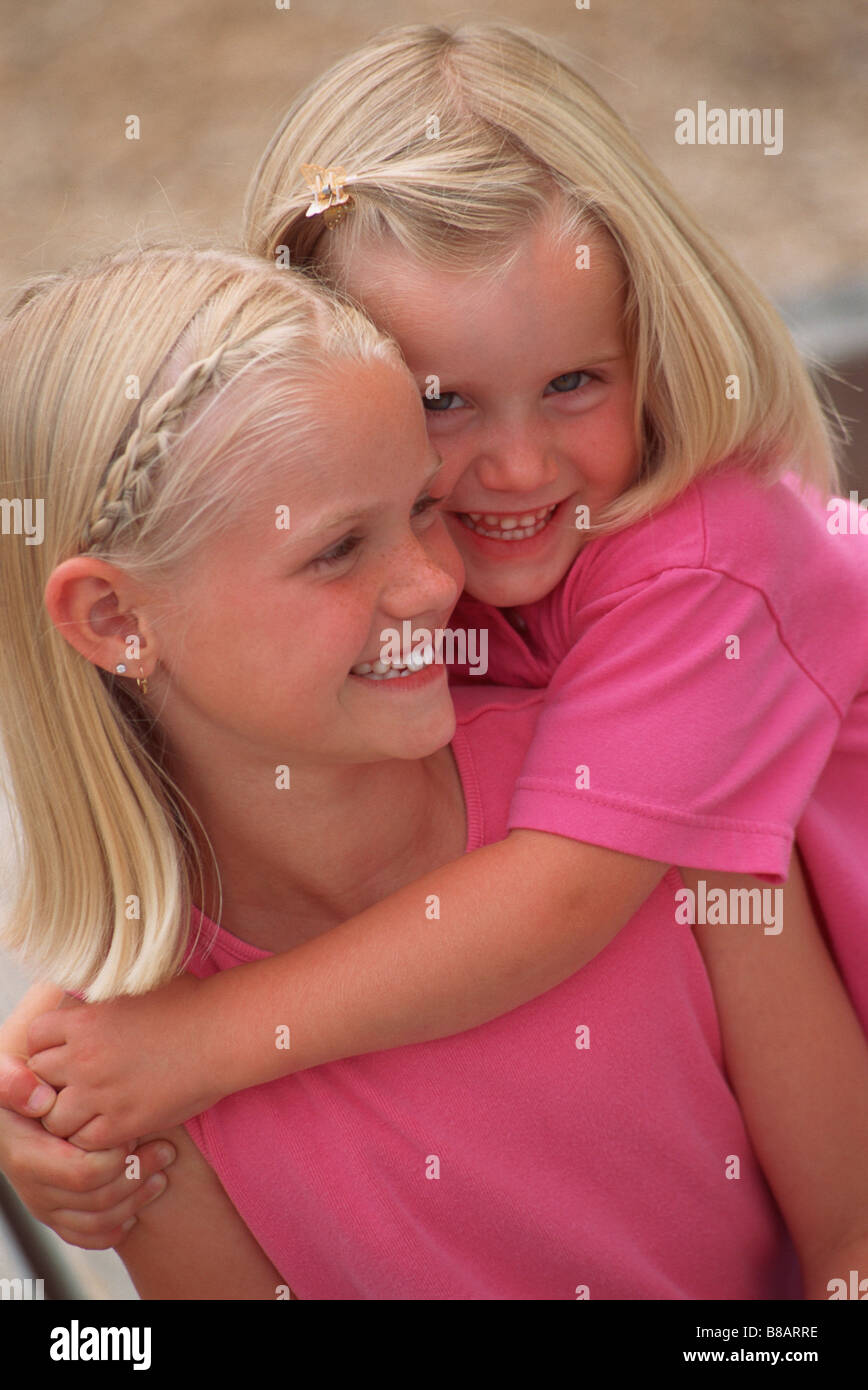 FV3405, Trevor Bonderud; Blonde Sisters Hugging, Four Nine Years Old ...