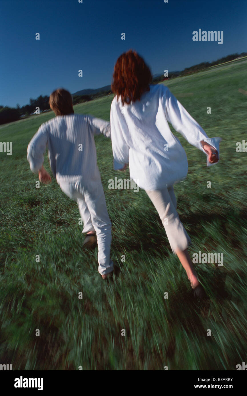 Man running through field hi-res stock photography and images - Alamy