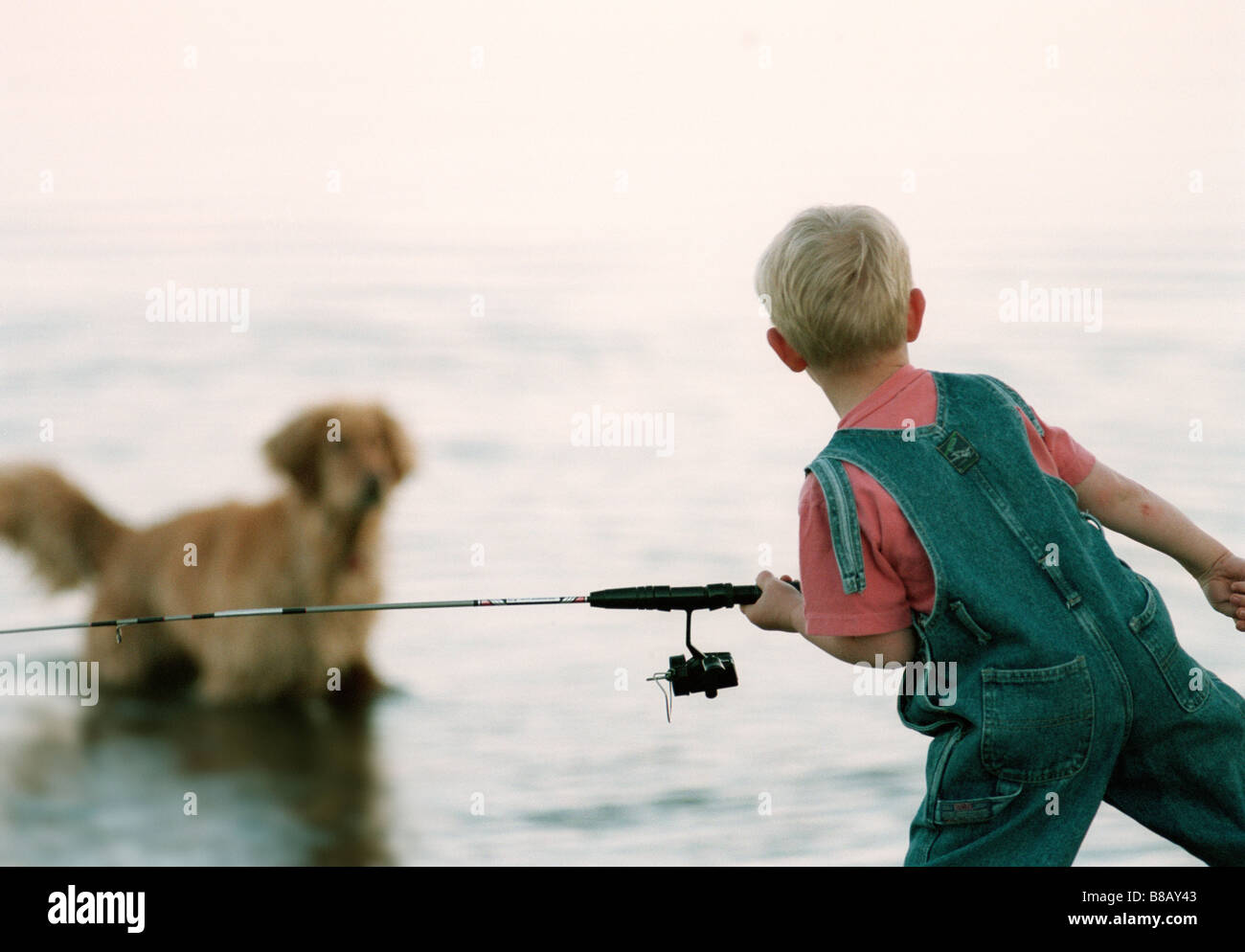 Boy fishing dog hi-res stock photography and images - Alamy