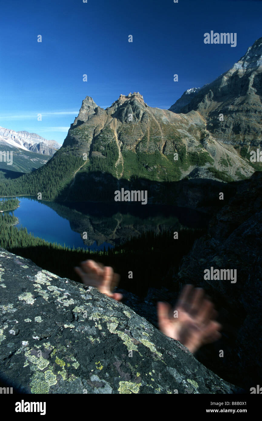 Hands reaching up to mountain ledge hi-res stock photography and images ...