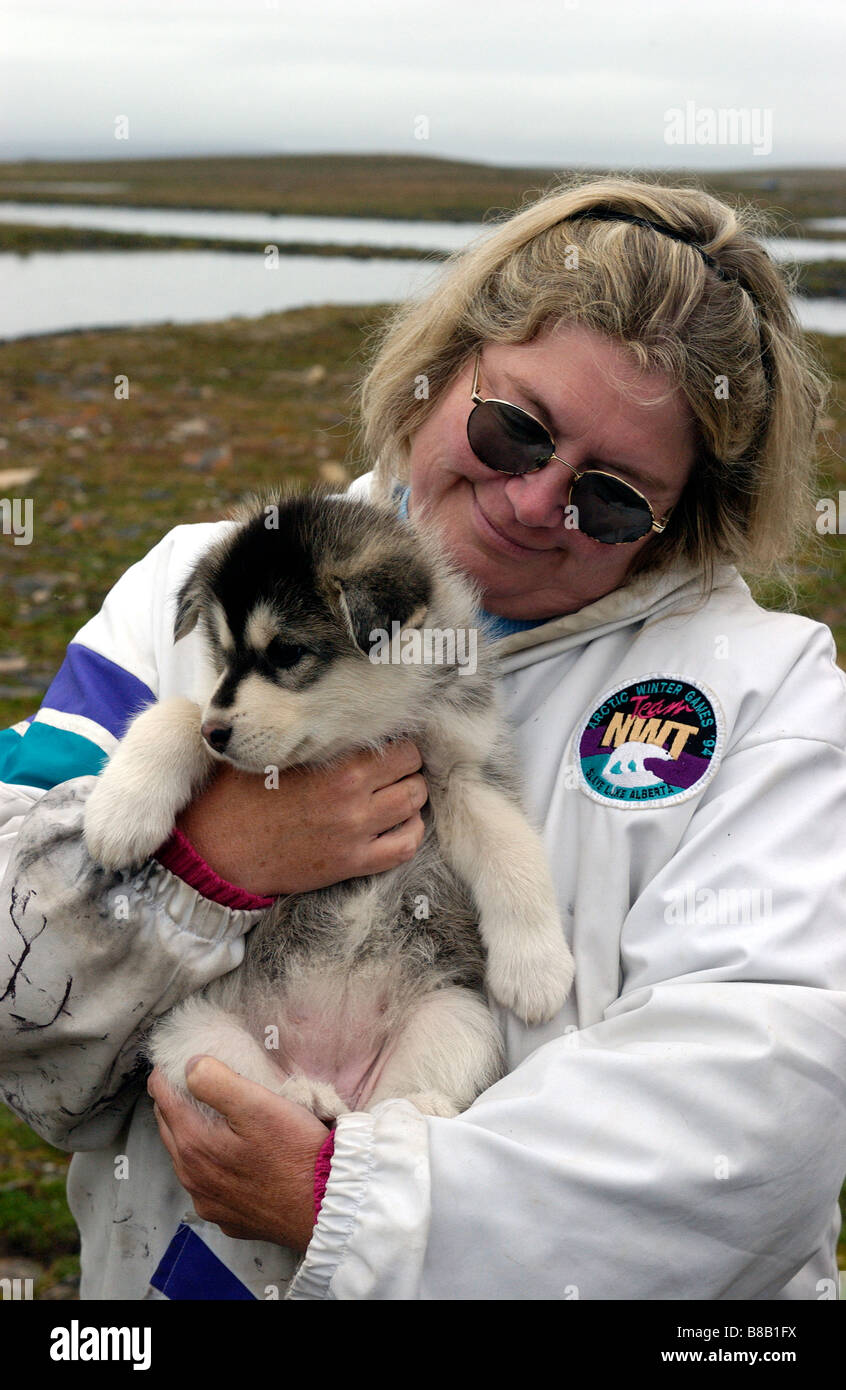 Women holding Husky Puppy Stock Photo - Alamy