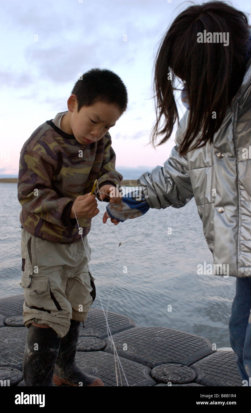 Boy Fishing Wharf Cambridge Bay Nunavut Stock Photo - Alamy