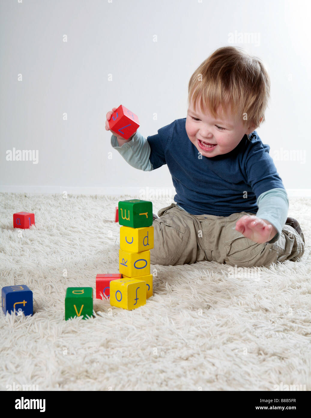 Baby boy playing with building blocks (with signed model release ...