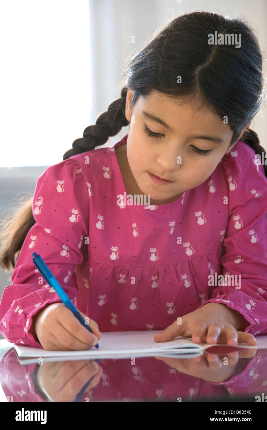 Little girl is writing letters Stock Photo - Alamy