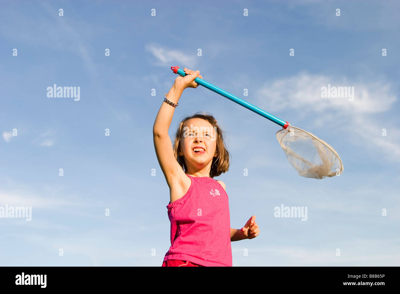 Child chasing butterfly hi-res stock photography and images - Alamy
