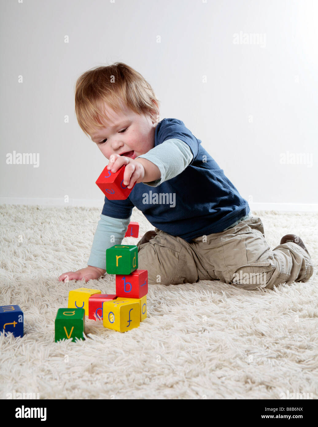 Baby boy playing with building blocks (with signed model release ...