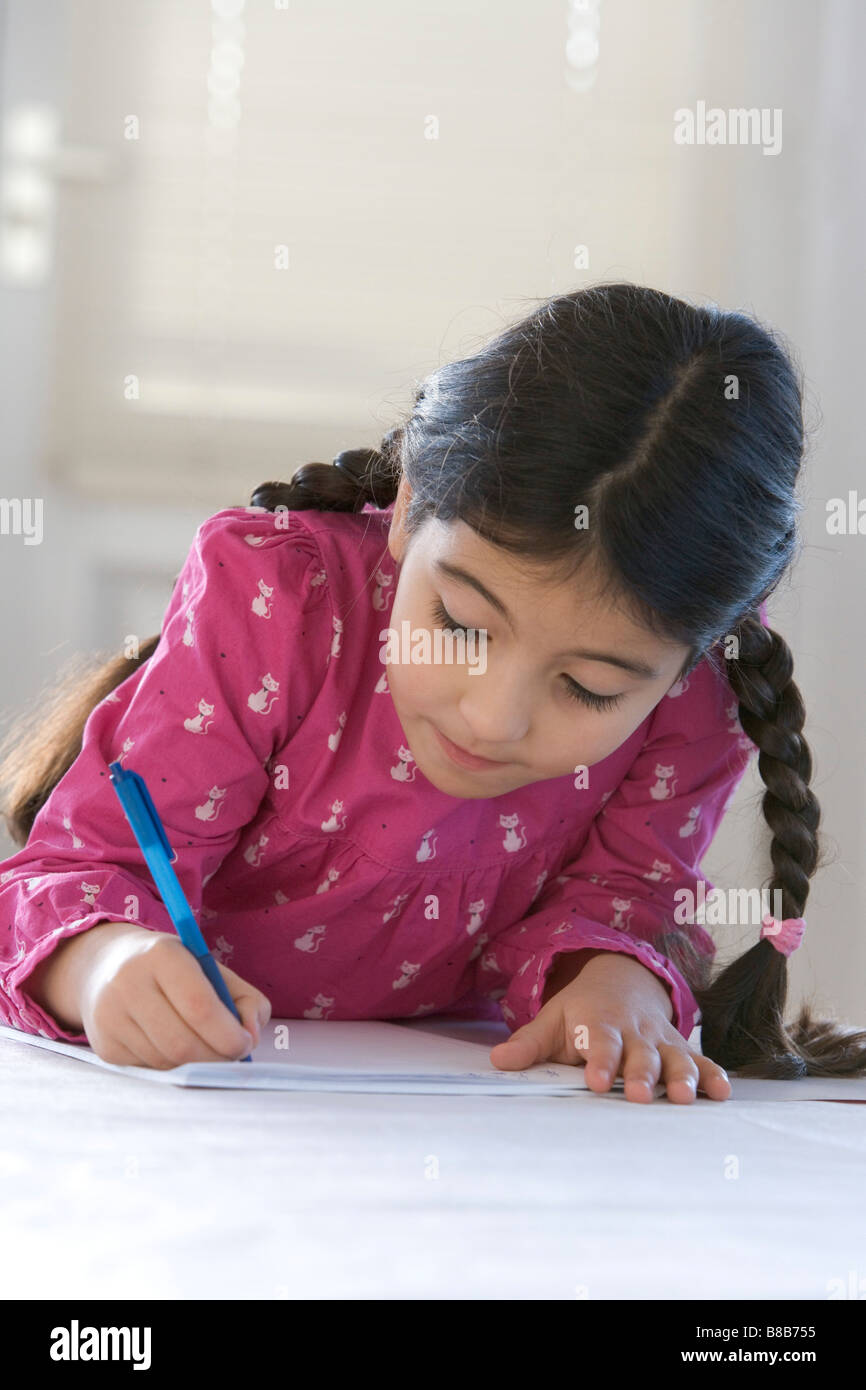 Little girl is writing letters Stock Photo - Alamy