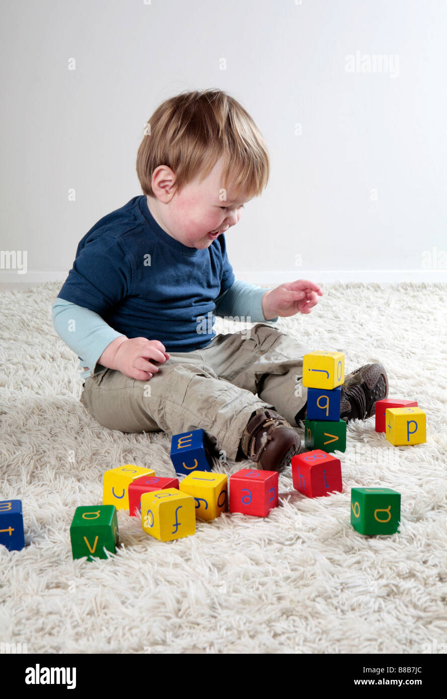 Baby boy playing with building blocks (with signed model release ...
