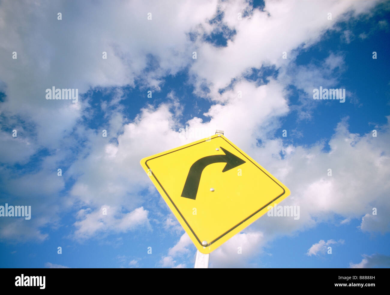 Turn Sign against Blue Sky Clouds Stock Photo - Alamy